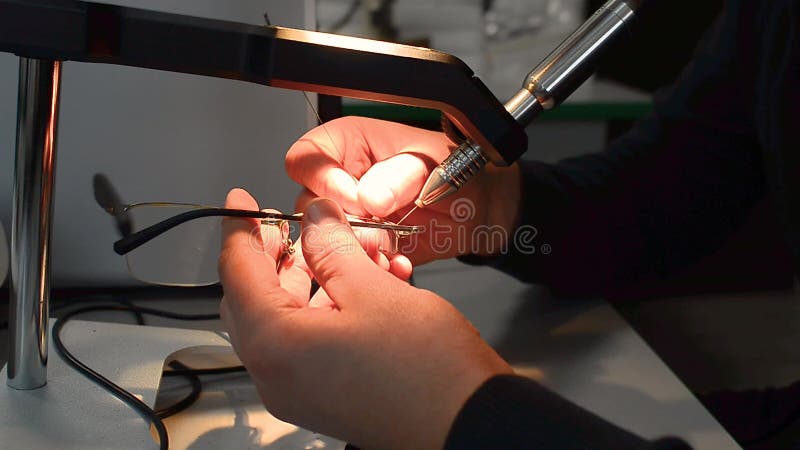 Hands Man Welds a Thin Frame for Glasses. Spot Welding. Stock Video ...