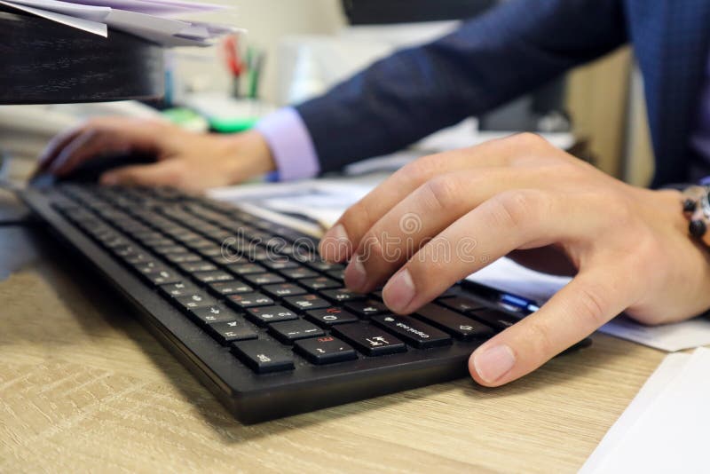 Hands of a Man Working on a Computer Keyboard , Close-up, Side View ...