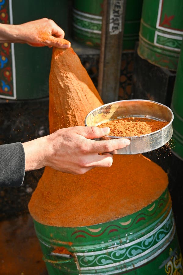 The Hands of a Man Working on a Spices Container Outside a Shop in ...