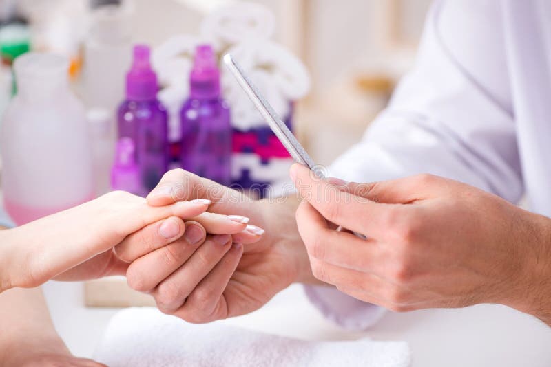 The Hands during Manicure Care Session Stock Image - Image of holding ...