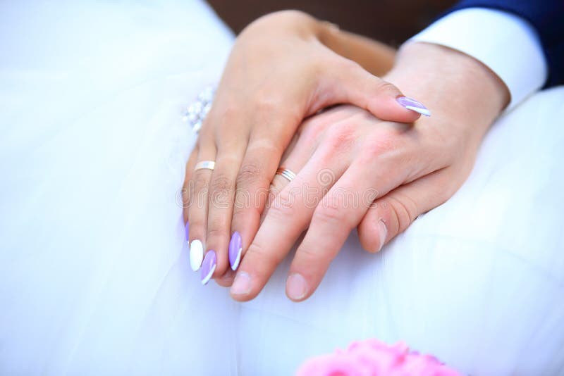 Hands of a Married Couple with Wedding Rings Stock Photo - Image of ...