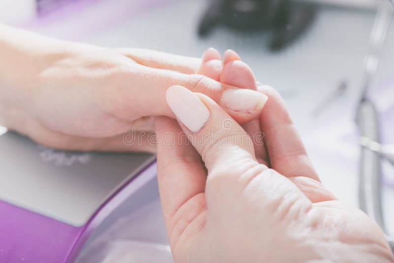 The Hands of the Master of Manicure and the Hands of the Client Close ...