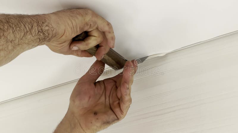 Hands of Master Pulling Stretch Ceiling with Spatula Stock Footage ...