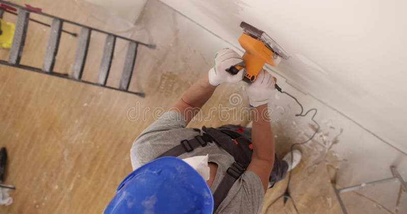 Hands of Master Removing Plaster from Wall Using Grinder Stock Video ...