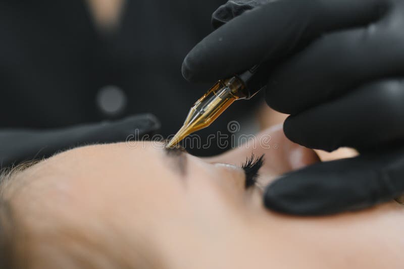 Hands of the Master Who Performs the Procedure of Permanent Makeup of ...