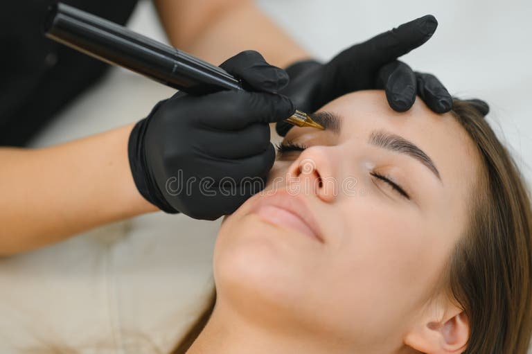 Hands of the Master Who Performs the Procedure of Permanent Makeup of Eyebrows. Permanent ...