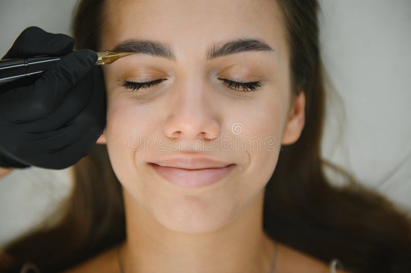 Hands of the Master Who Performs the Procedure of Permanent Makeup of ...