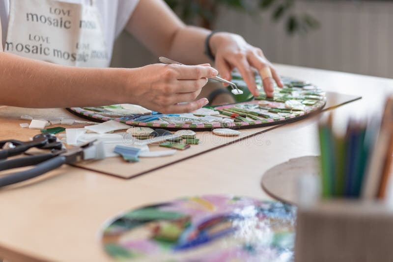 Hands of Master Working on New Modern Colorful Mosaic. Close-up Stock ...