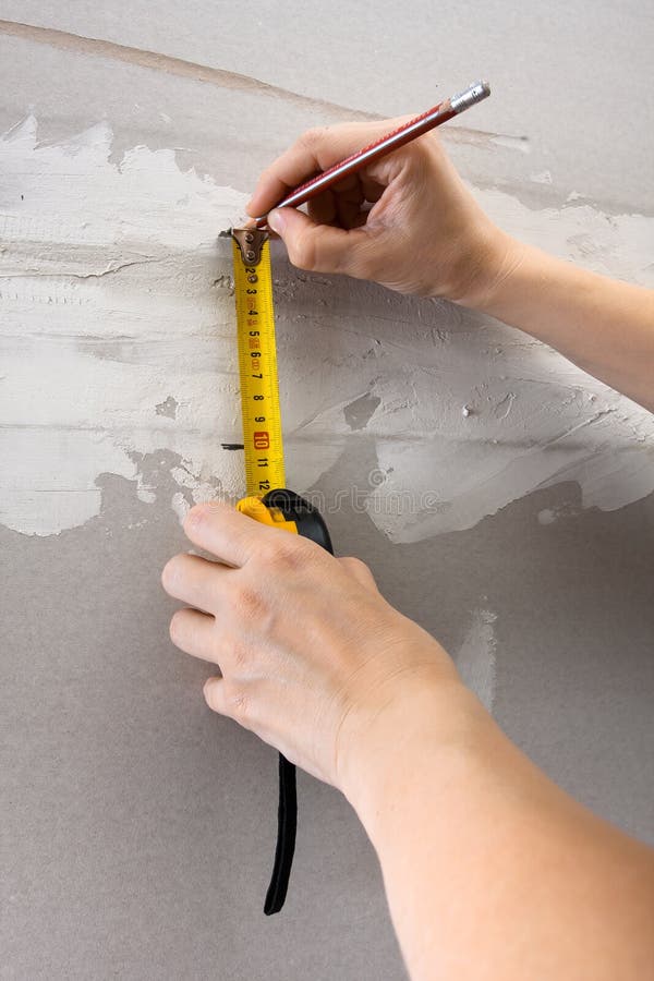Hands Measuring Wall with Tape Measure, Closeup Stock Photo - Image of ...