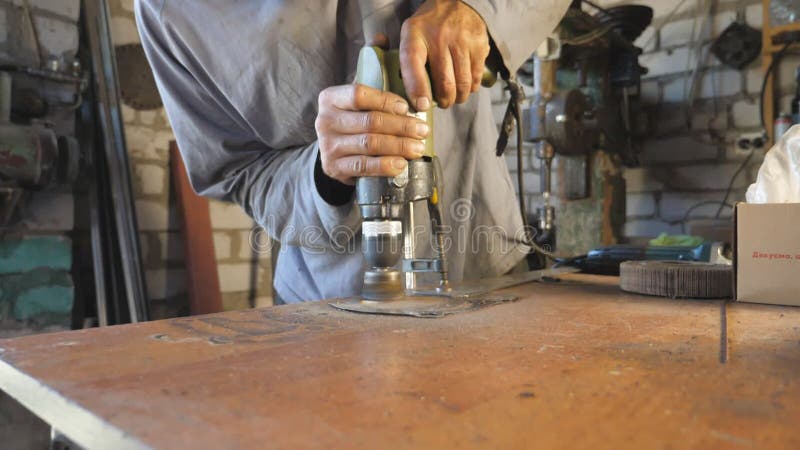 Hands of Mechanic Hold Tool during Operation. Man Works in His Garage ...