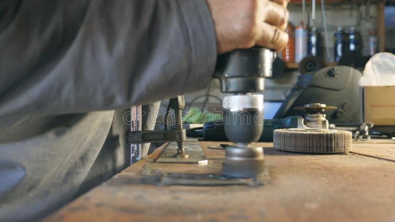 Hands of Mechanic Hold Tool during Operation. Man Works in His Garage ...
