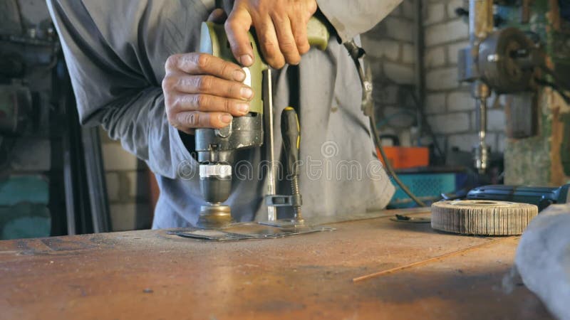 Hands of Mechanic Hold Tool during Operation. Man Works in His Garage ...