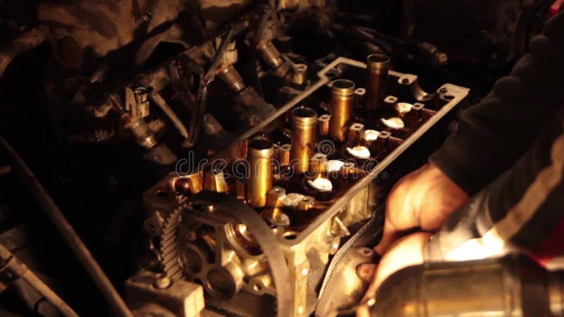 Repairing an Internal Combustion Engine in a Car Service Center Stock ...