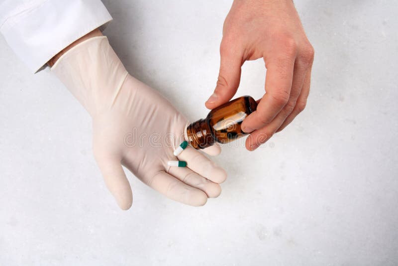 Hands and medicine pills stock image. Image of health - 23994437