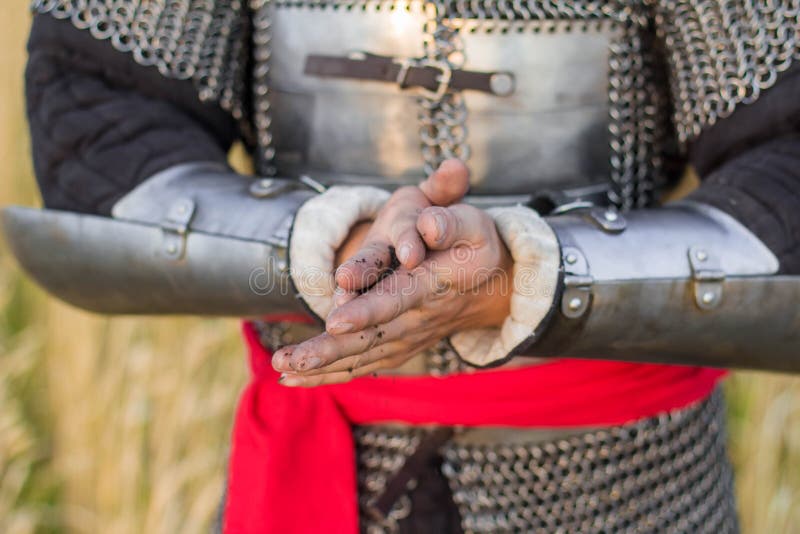 Hands of a Medieval Warrior, Close-up, Stained with Earth. Holds the ...