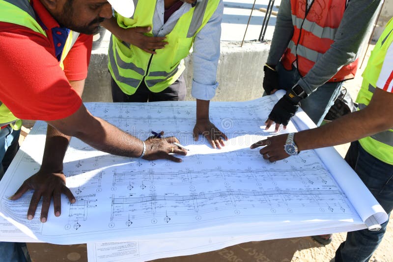 Hands of Men Showing the Blueprints at Construction Site Editorial ...