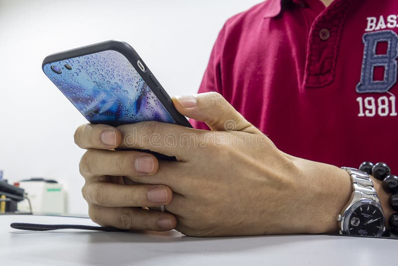 Hands on mobile phones editorial stock image. Image of mans - 145762389