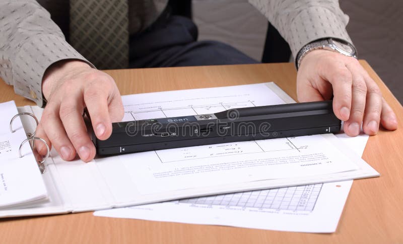 Hands Move a Hand Scanner while Scanning a Document Stock Photo - Image ...