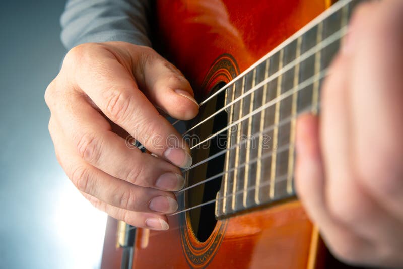 Hands of the Musician Playing on Classical Guitar Stock Image - Image ...