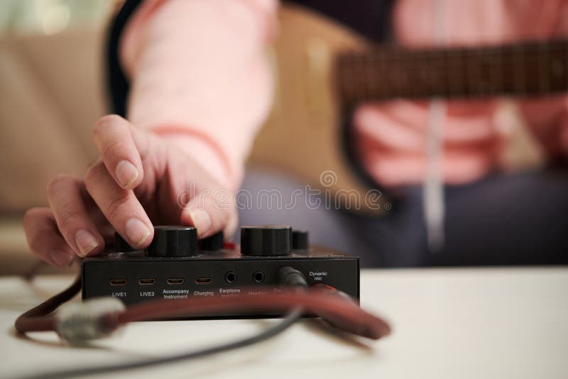 Musician Using Amplifier stock photo. Image of hand - 275977282