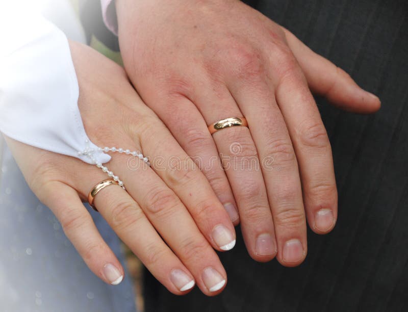 Hands of a Newly-married Couple Stock Photo - Image of groom, black ...