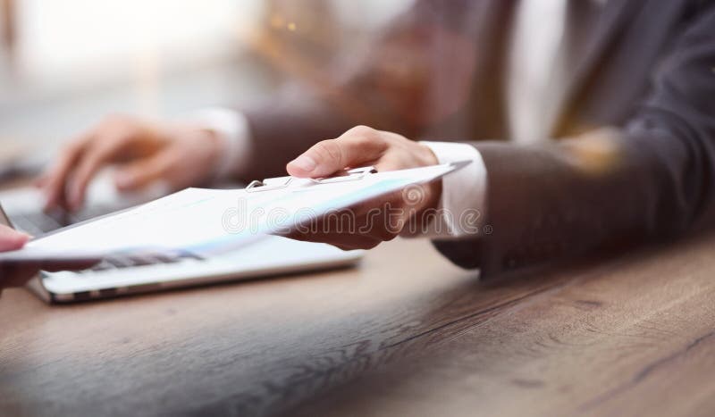 Office Employee Working with Documents at Business Desk in a Business ...