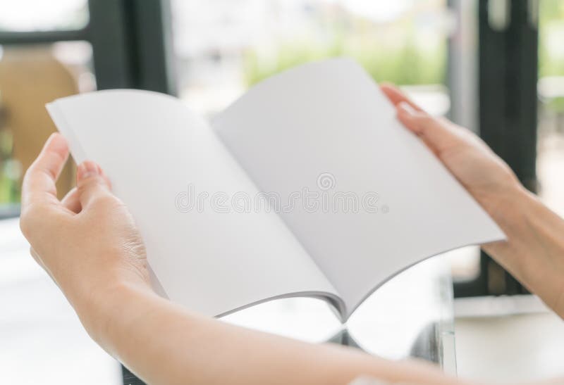 Hands open book on table . stock image. Image of male - 78055941