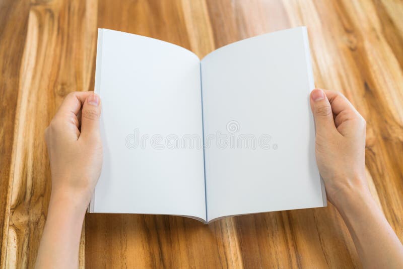 Hands Open Book on Wood Table . Stock Image - Image of male, book: 82411627