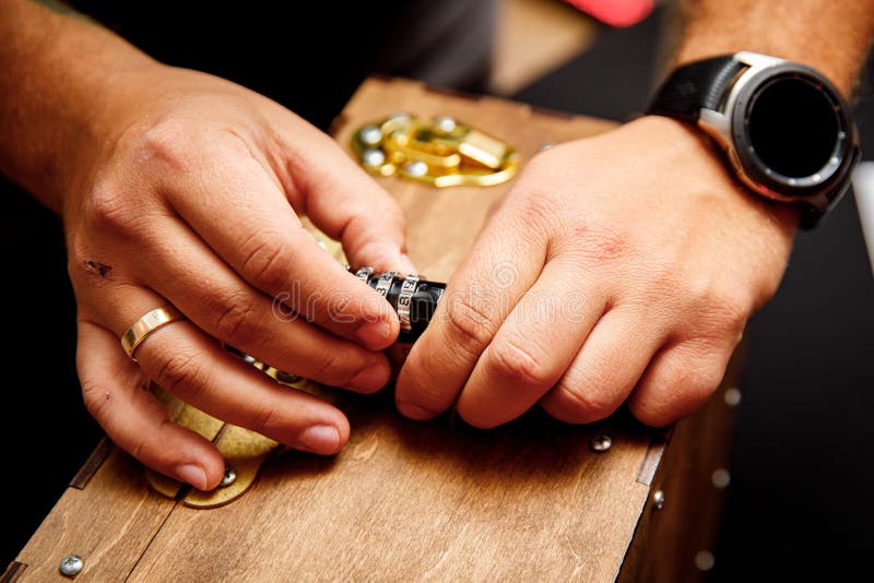 Hands Open the Combination Lock Close-up. Stock Image - Image of ...