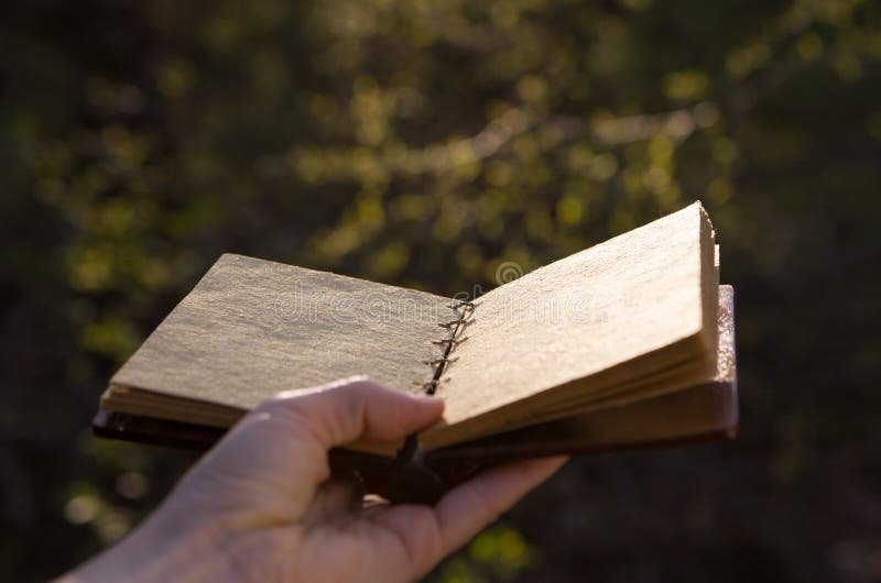 Hands and Opened Vintage Book Over Table Stock Photo - Image of ...