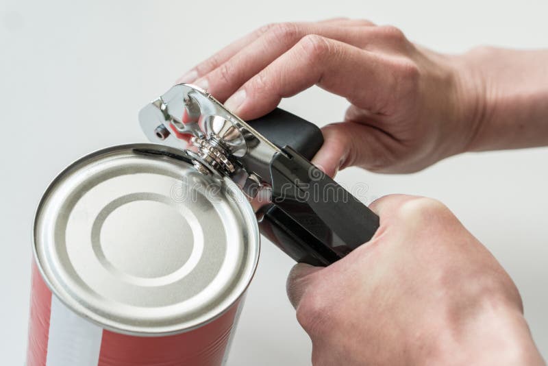 Hands Opening a Can in a Kitchen with a Tin Opener Stock Image - Image ...