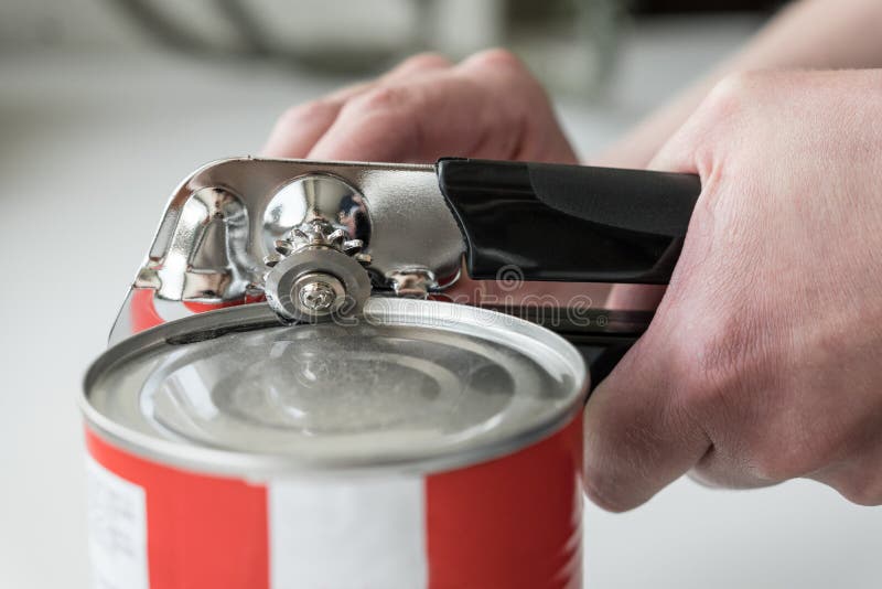 Hands Opening a Can in a Kitchen with a Tin Opener Stock Image - Image ...