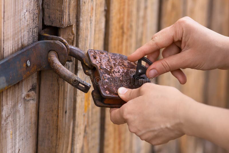 Hands opening the padlock stock image. Image of human - 70993279