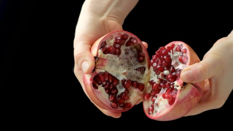 Hands Opening Pomegranate, Black Background, Slow Motion Stock Video ...