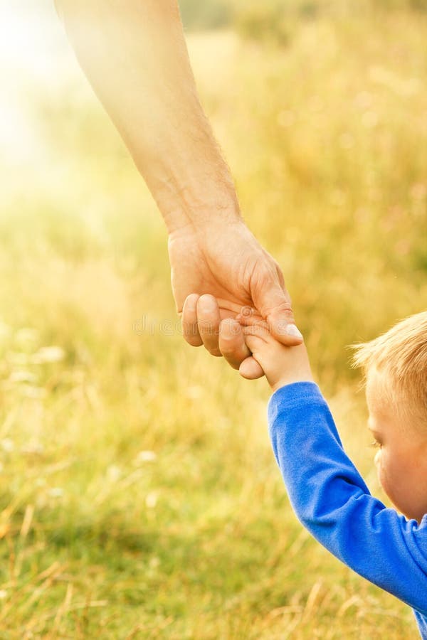 Hands of Parent and Child Outdoors in the Park Stock Image - Image of ...