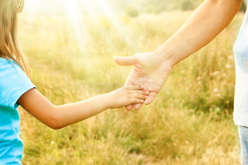 Hands of Parent and Child in Nature Stock Image - Image of generation ...