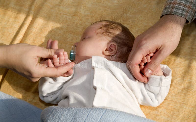 Hands of parents and baby stock photo. Image of woman - 11006098
