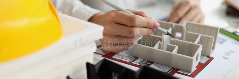 Hands with a Pen Over the Layout and Building Plan Stock Image - Image ...