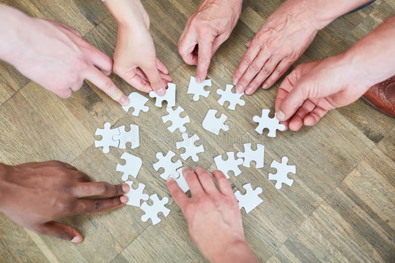 Hands of People with Lots of Puzzle Pieces Stock Photo - Image of ...