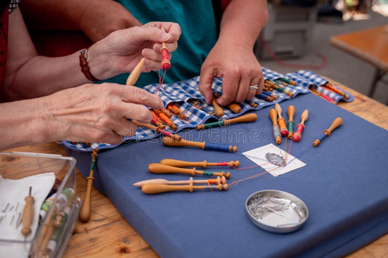 Hands of People Preparing and Making Bobbin Lace. Colorful Lace Threads ...