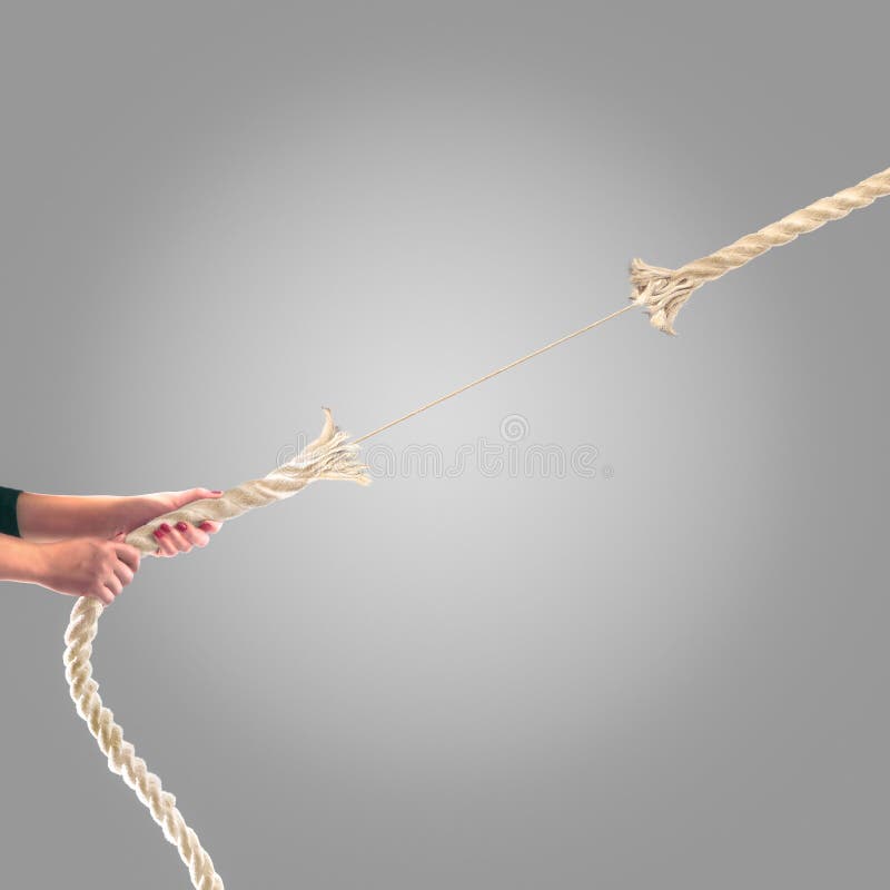 Hands of People Pulling the Rope on a Gray Background. Competition ...