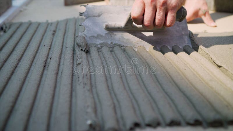 Hands Perform Cement Work, Apply Cement To the Surface. Laying Stone on ...