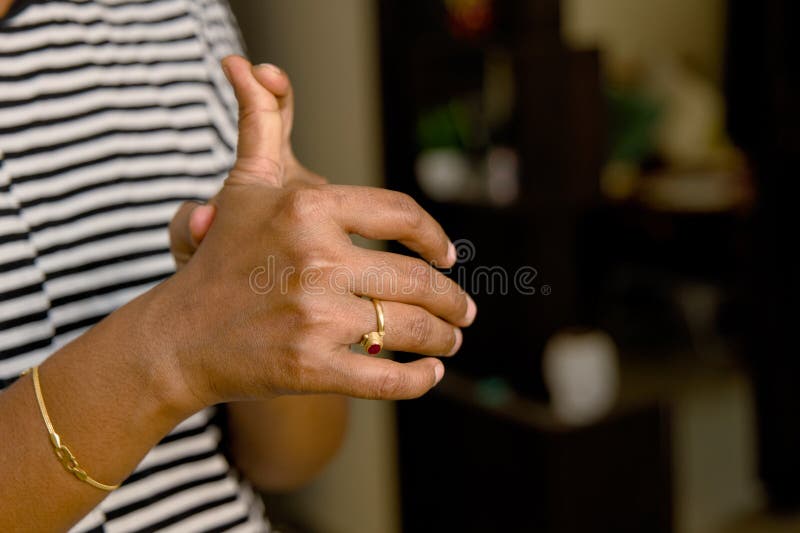 Hands Performing a Gesture Indoors with Soft Lighting Stock Image ...