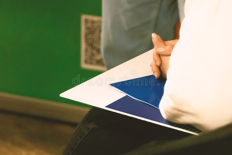 Hands of a Person with Documents Waiting for an Appointment Stock Image ...