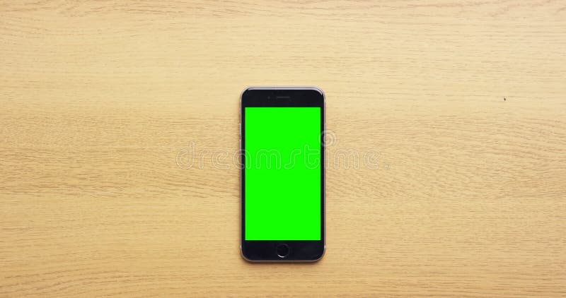 Hands, Phone and Green Screen with Scroll on Table in Closeup, Typing ...