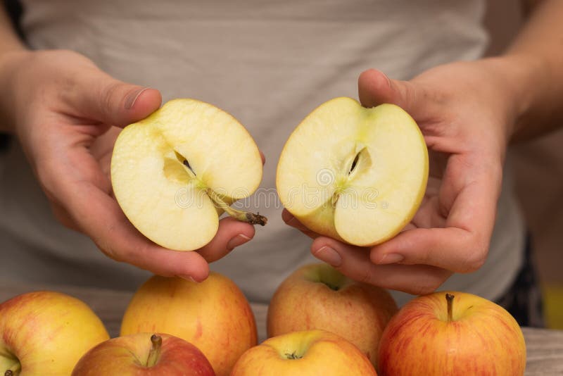 Hands Picking a Fresh Apple. Female Hands Holding Fresh Ripe Apple ...