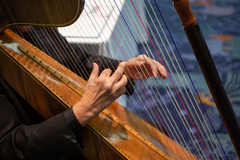 Hands play the harp stock photo. Image of product, concert - 176953396
