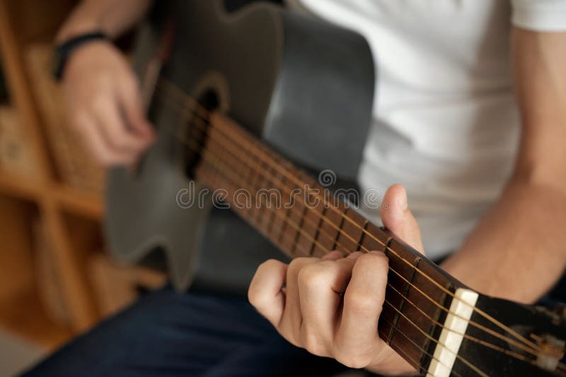 Hands playing guitar stock image. Image of unrecognizable - 112804821