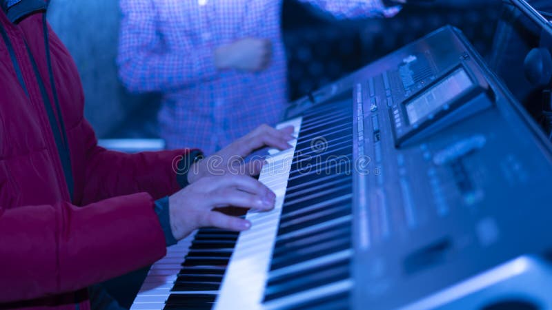 Hands playing a keyboard stock image. Image of performance - 264697859