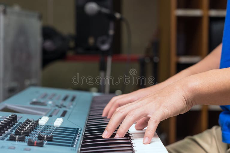 Hands Playing the Keyboard or Piano, Focus Middle Finger Stock Photo ...